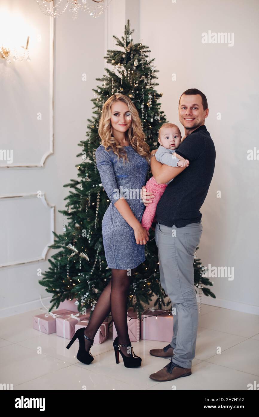 Family portrait of two lovely parents and their child Stock Photo - Alamy