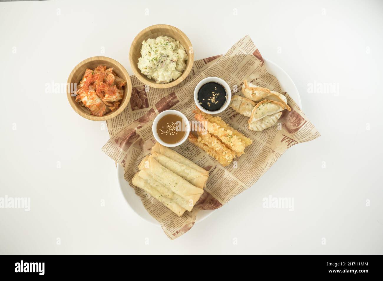 Closeup shot of fried spring rolls, tempura, and dim sum isolated on a ...