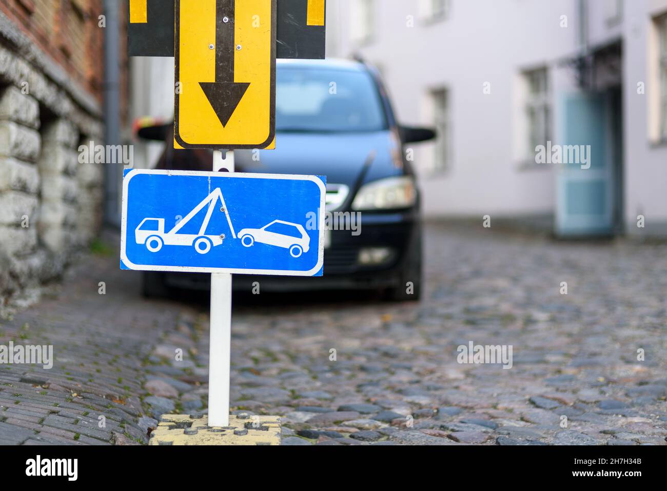 Tow away zone road sign with car on background on street Stock Photo ...