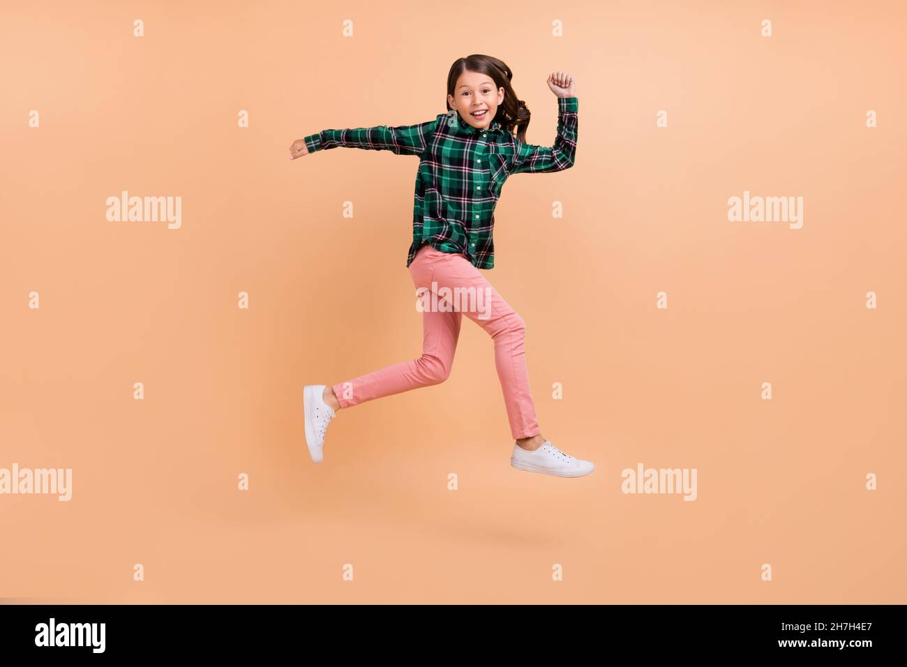 Photo of sweet funky school girl dressed checkered clothes smiling ...