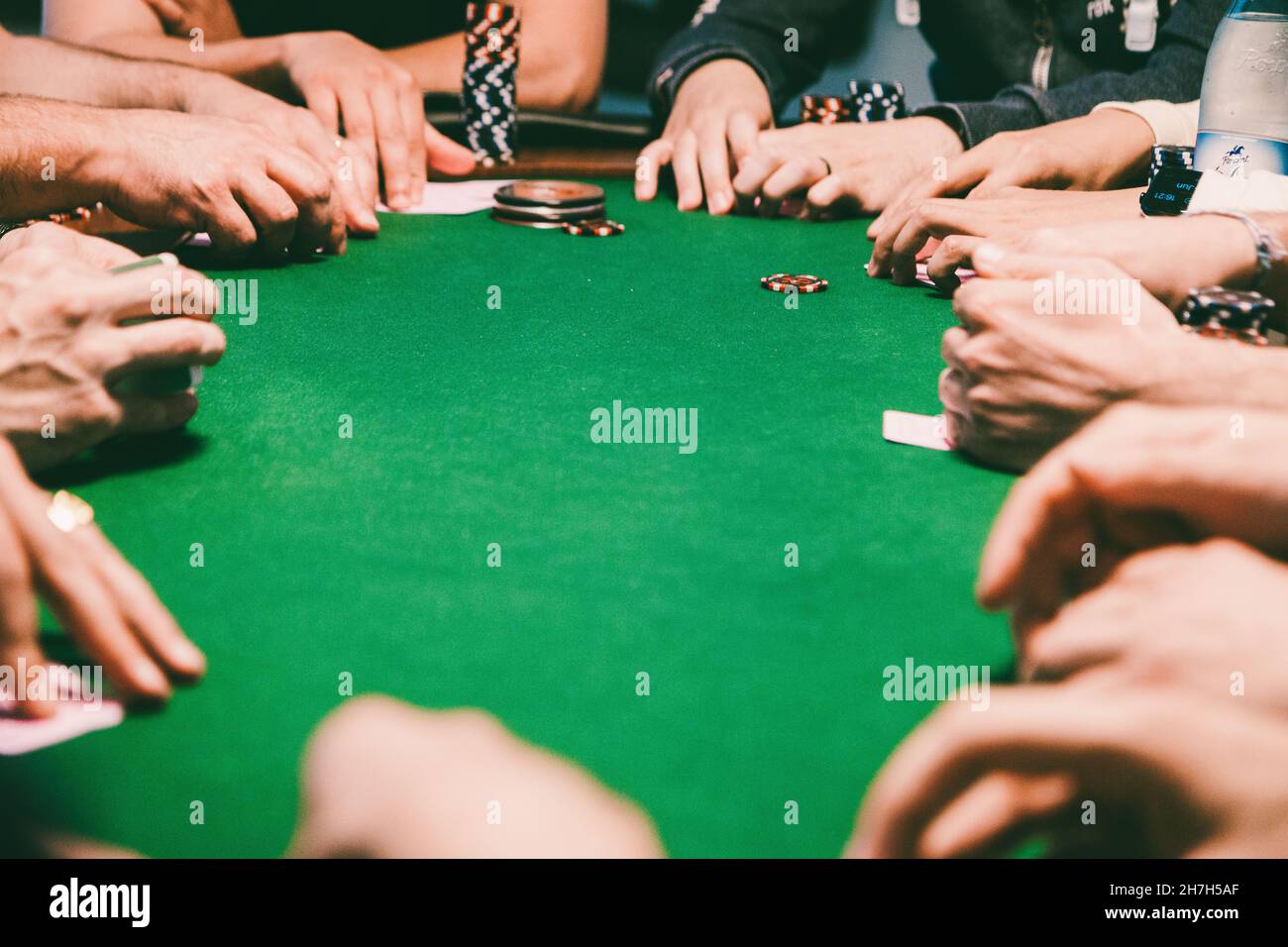 Group of friends playing Texas Hold 'Em during their leisure time Stock ...
