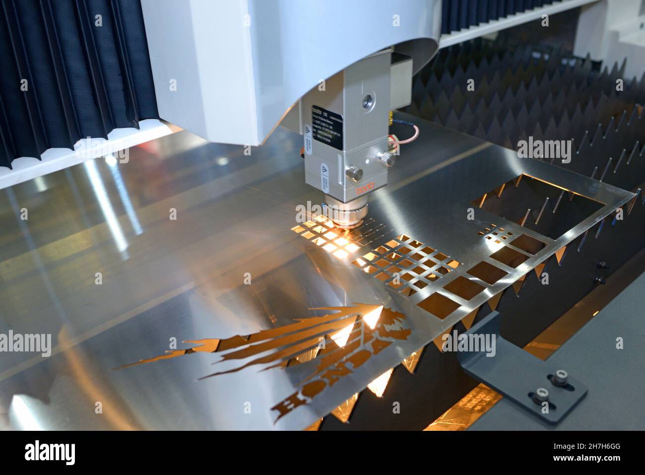 Laser machining. Laser cutting machine working cut metal sheet, Bodor ...