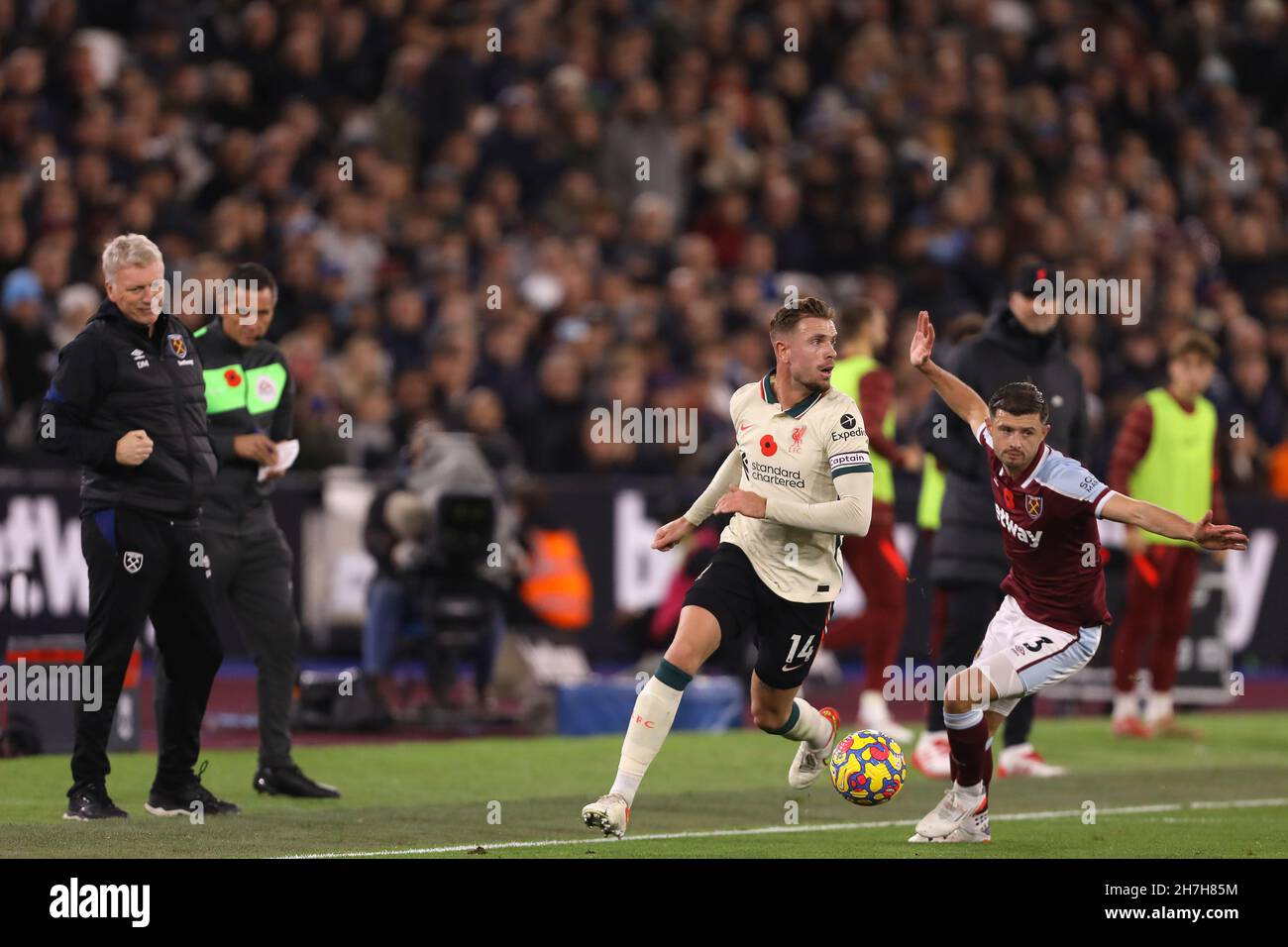 Jordan Henderson of Liverpool and Aaron Cresswell of West Ham United ...