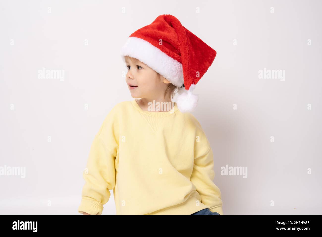 Cute little boy wearing santa hat isolated over white background Stock ...