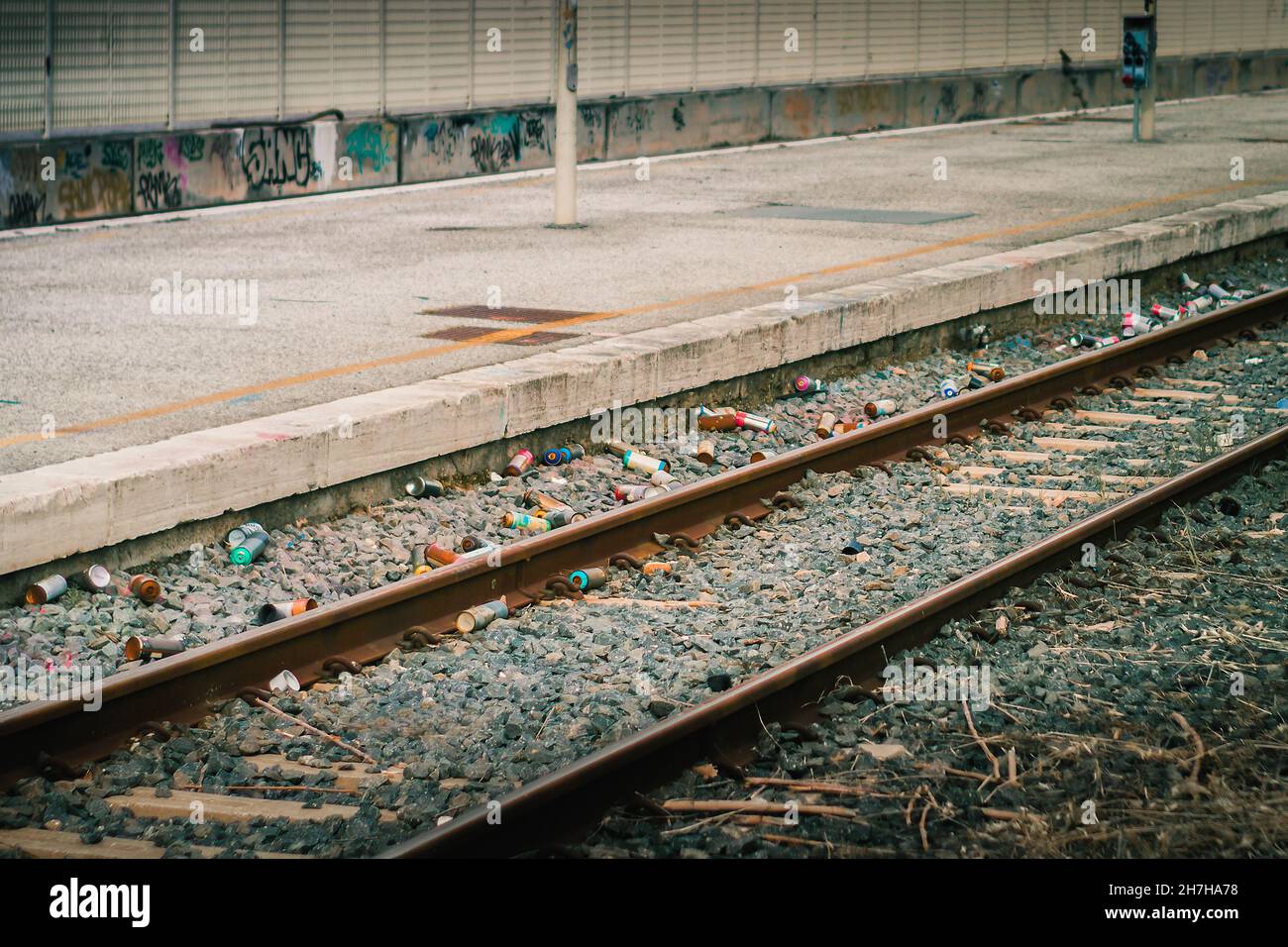 Spray cans near railroad tracks Stock Photo - Alamy