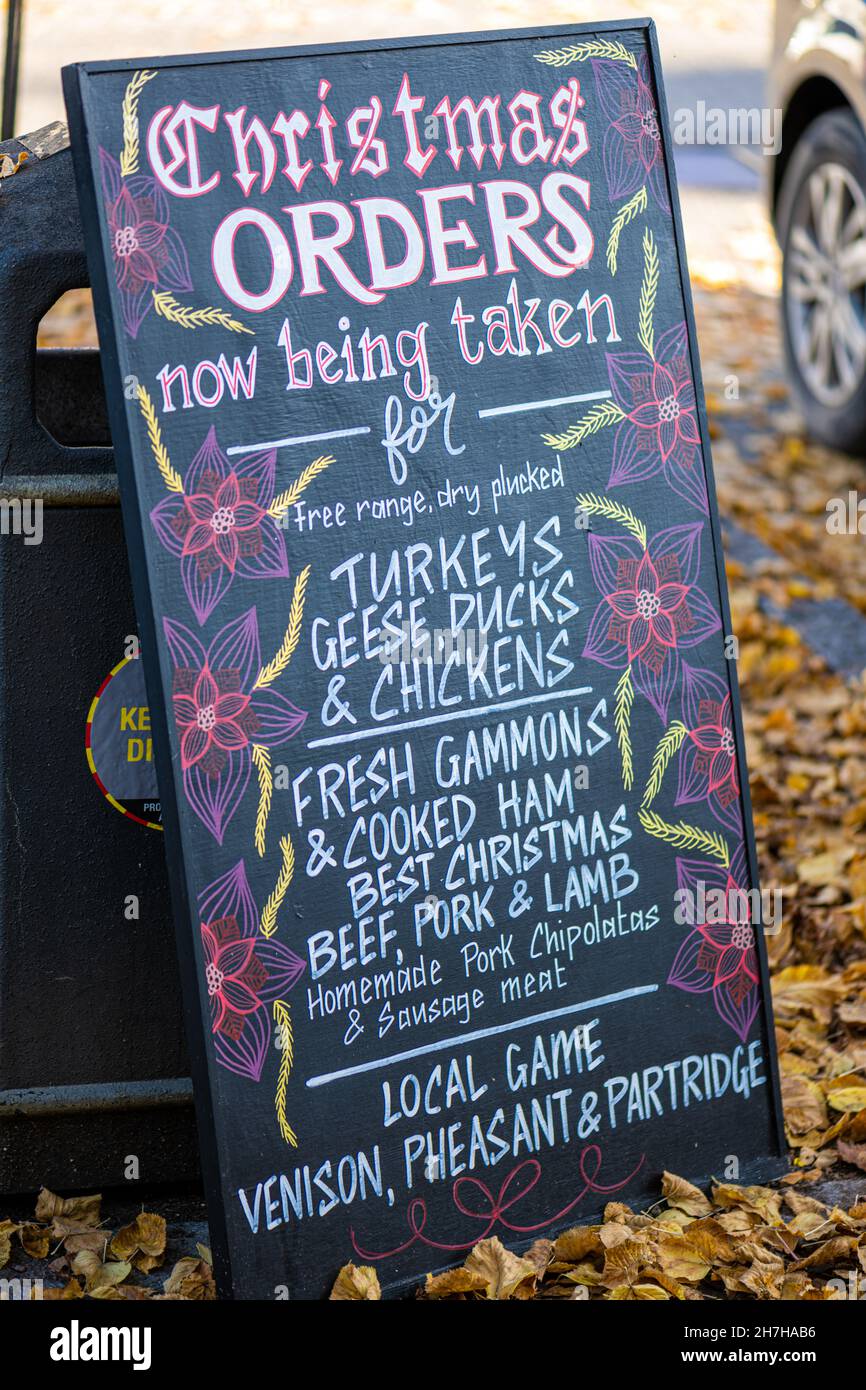 Christmas orders for turkeys on a high street butcher’s sign in New ...