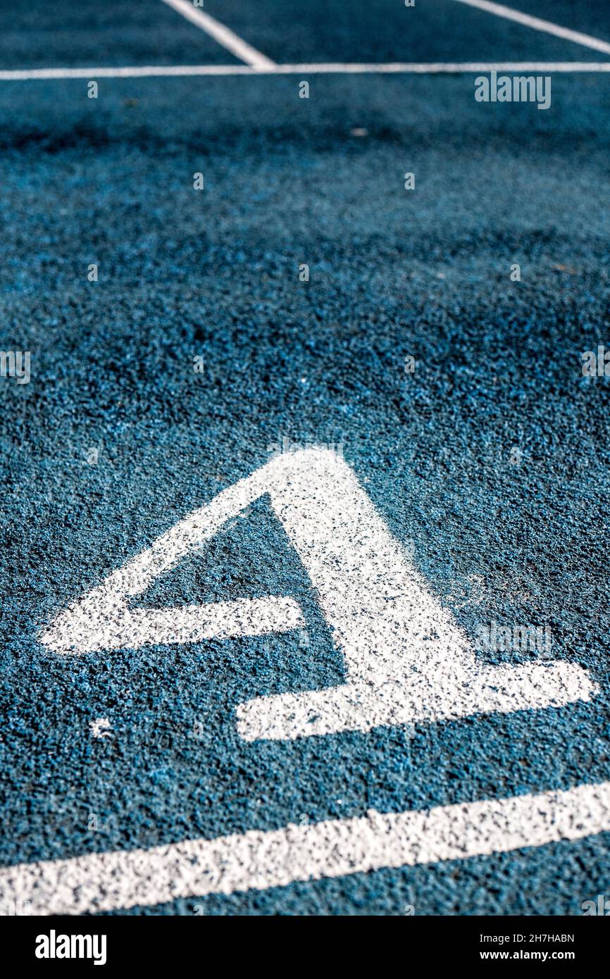 Lane four on the track field Stock Photo - Alamy