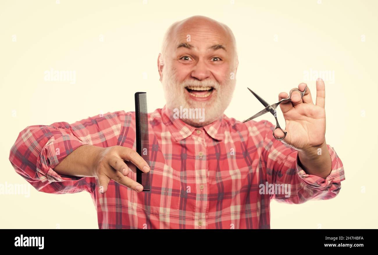 Barber work with sharp scissors. Man bearded handsome hairstylist ...