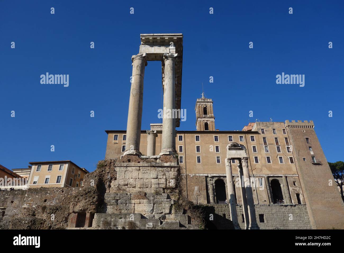 Low angle shot of the Temple of Vespasian and Titus in Roman Forum ...