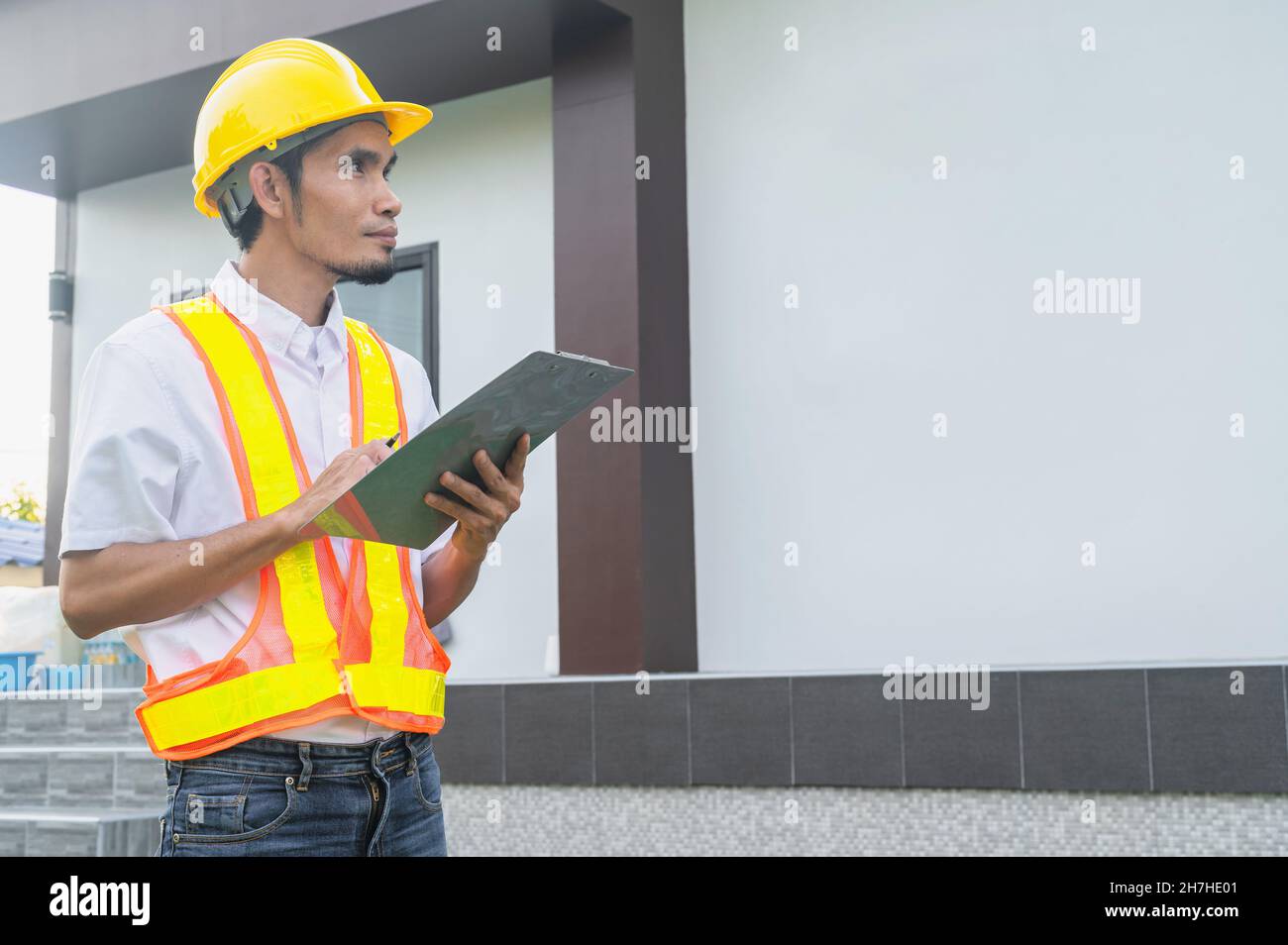 Engineer Auditor checking home building construction Stock Photo - Alamy