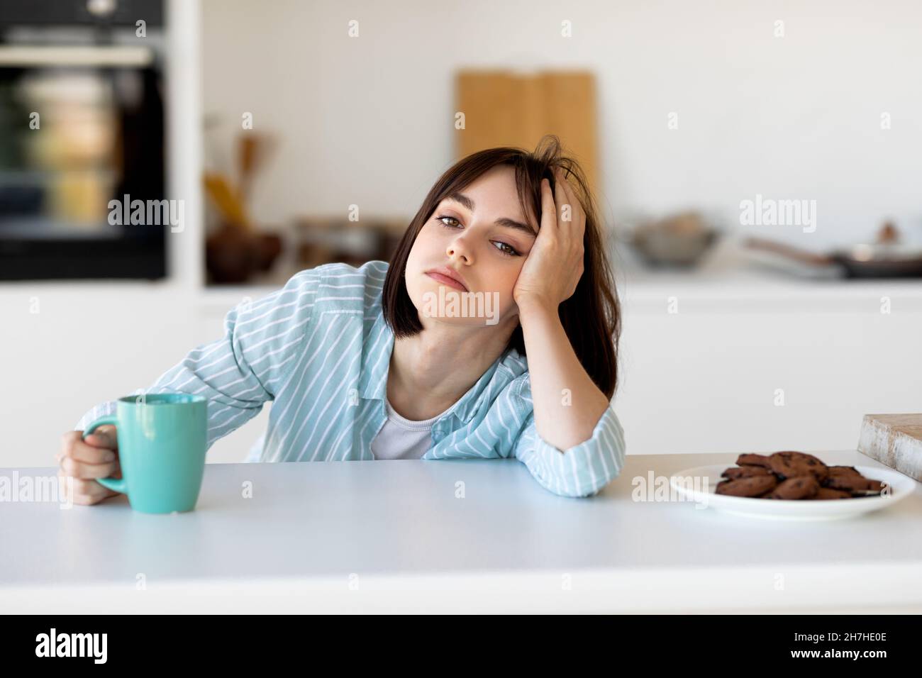 Tired And Sleepy Lady Drinking Coffee In The Morning Feeling Exhausted