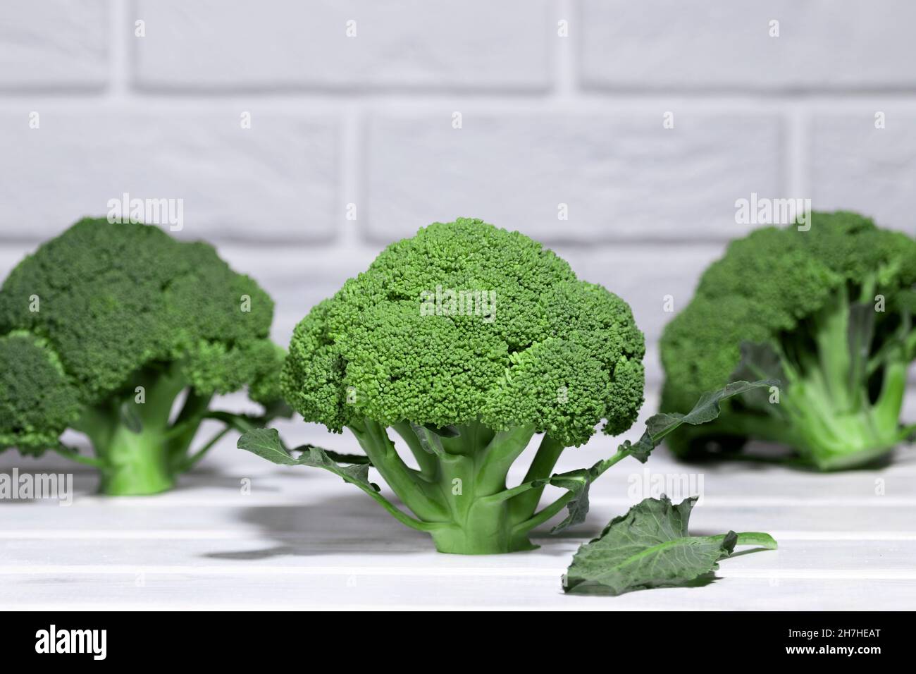 Raw green broccoli on white background, healhy eating diet Stock Photo ...