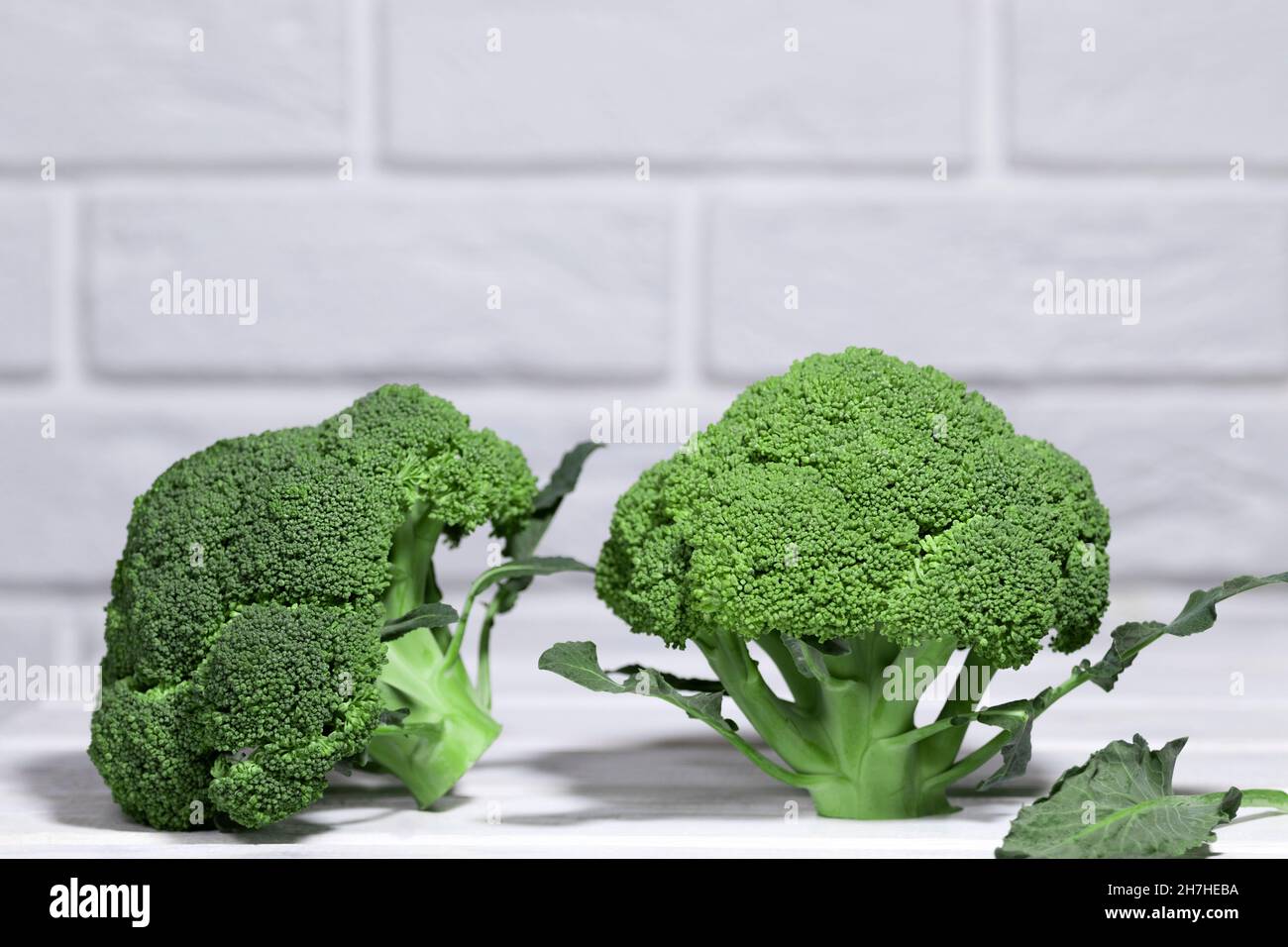 Raw green broccoli on white background, healhy eating diet Stock Photo ...