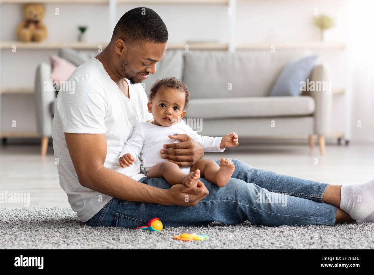 Happy Paternity Leave. Young Black Father Bonding With Infant Baby At ...