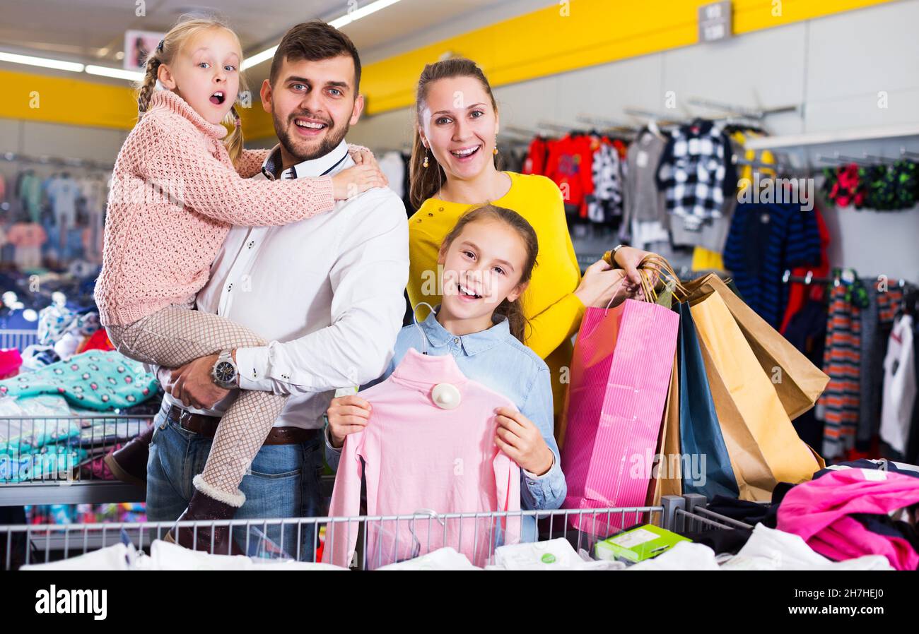 parents with two little girls during family shopping Stock Photo - Alamy