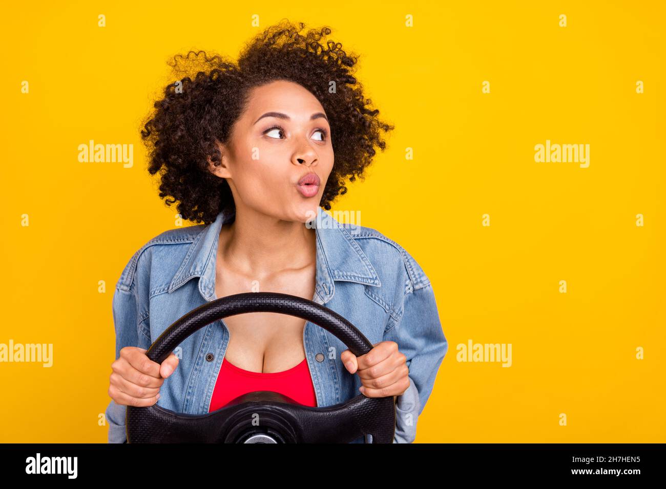 Photo of young shocked happy afro american woman look empty space drive ...