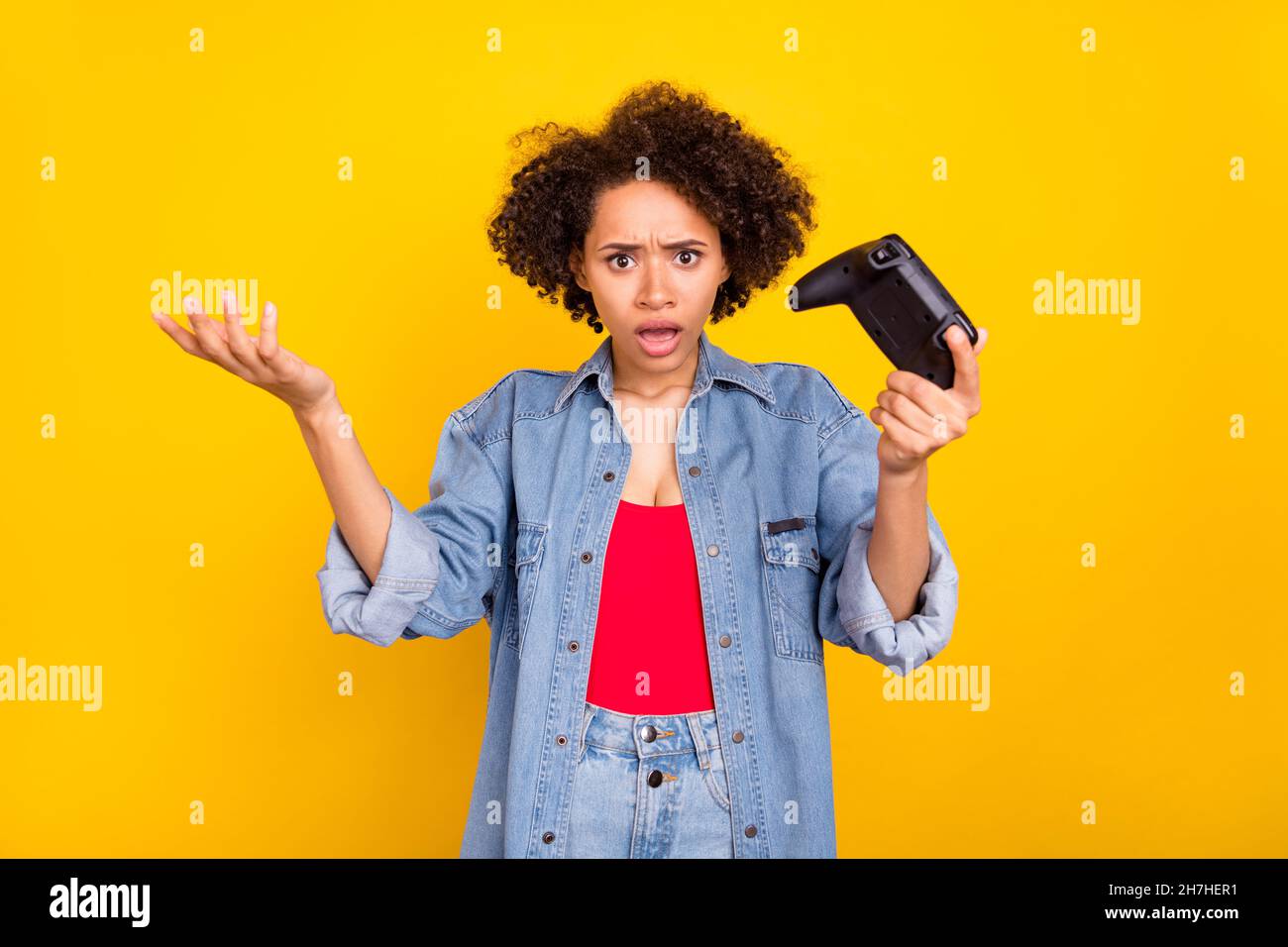 Photo of dark skin brunette woman wear denim shirt shrug shoulders hold ...