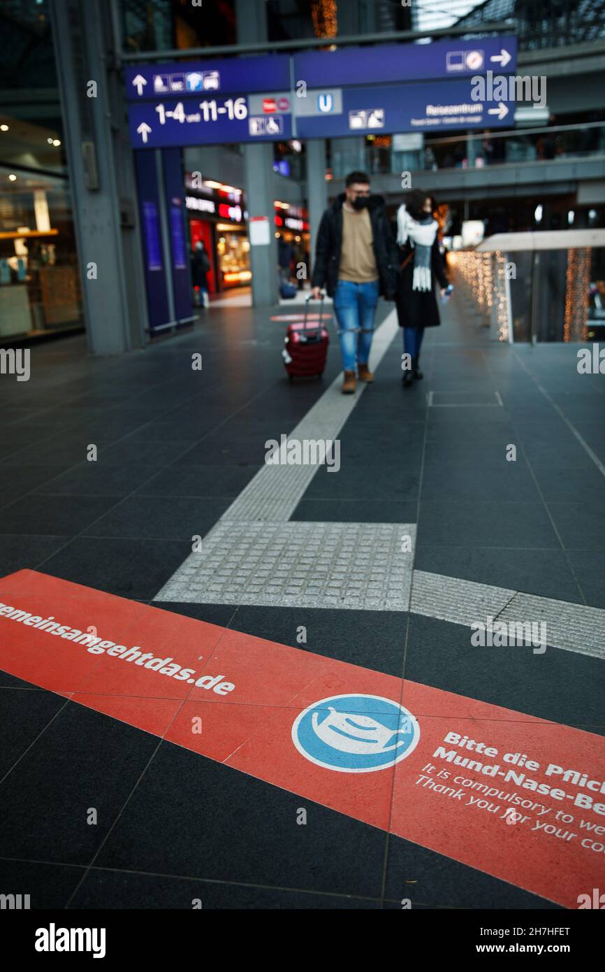 Berlin, Germany. 23rd Nov, 2021. Red signs on the floor in the entrance ...