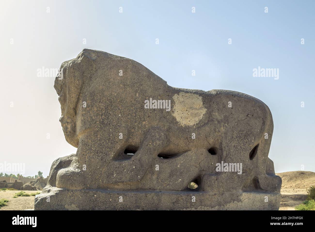 Statue of Lion of Babylon under the sunlight and a blue sky in Iraq ...