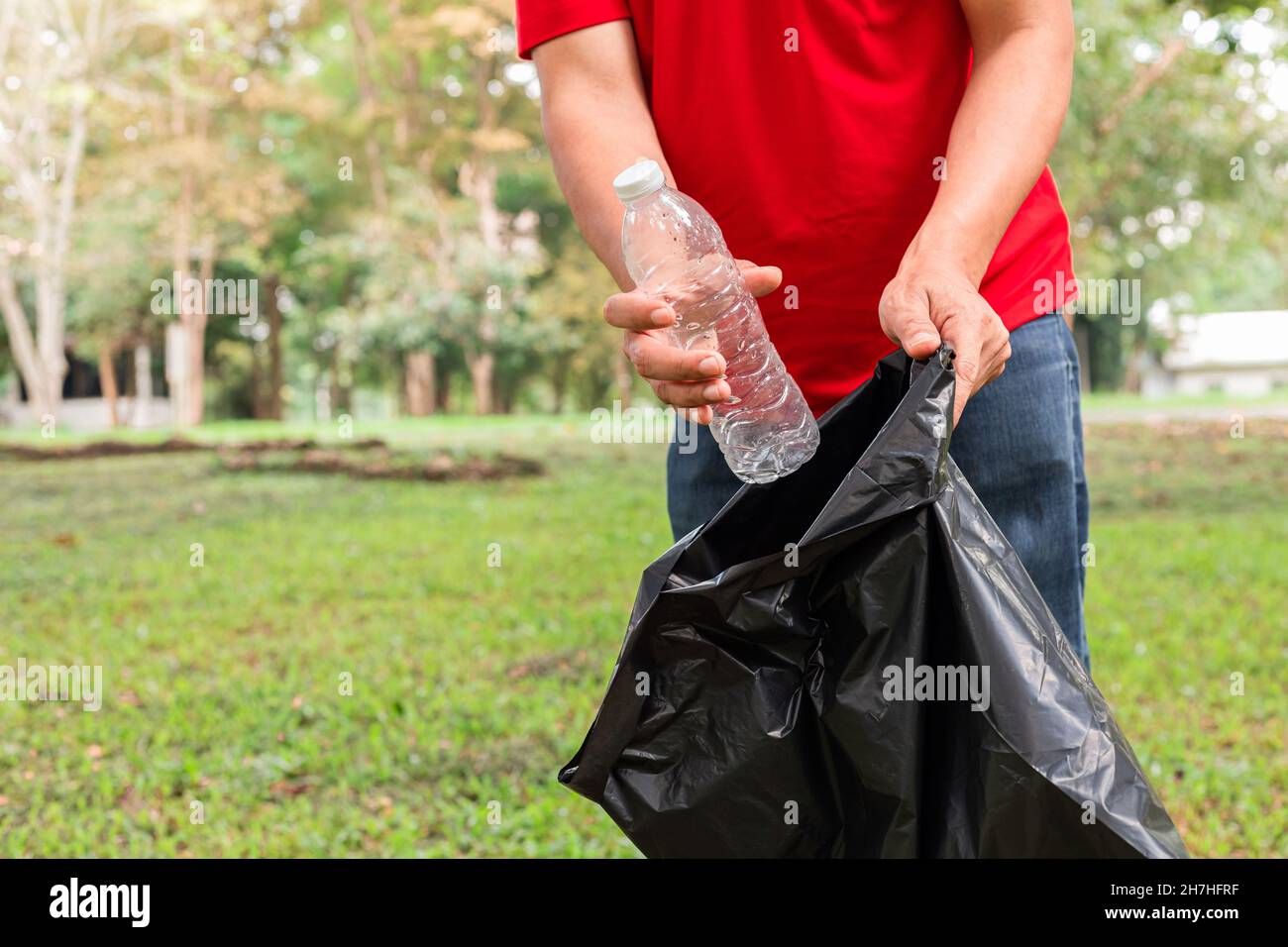 people collecting plastic bottles Stock Photo - Alamy
