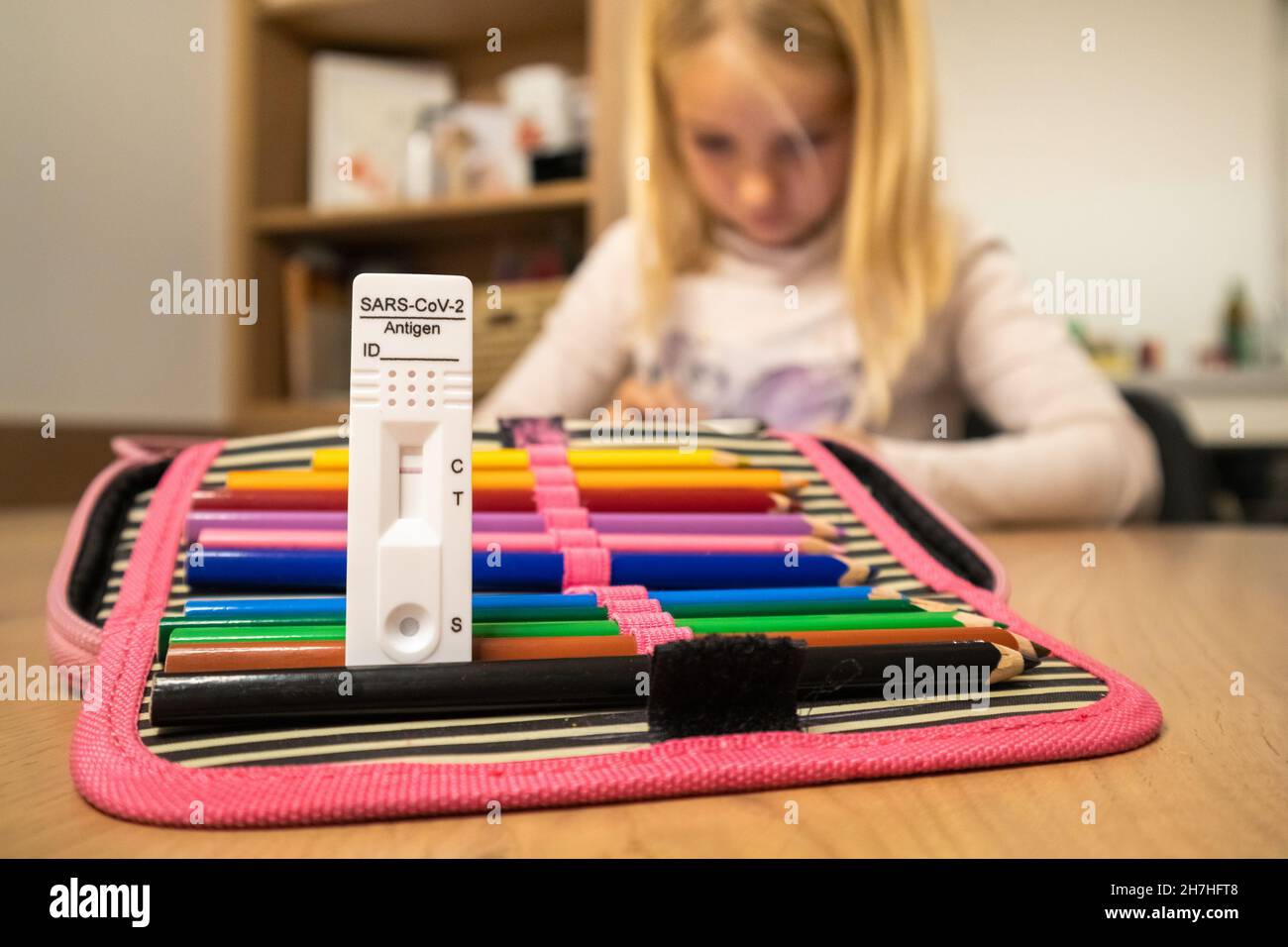 Girl child self testing at home for coronavirus before going to school ...