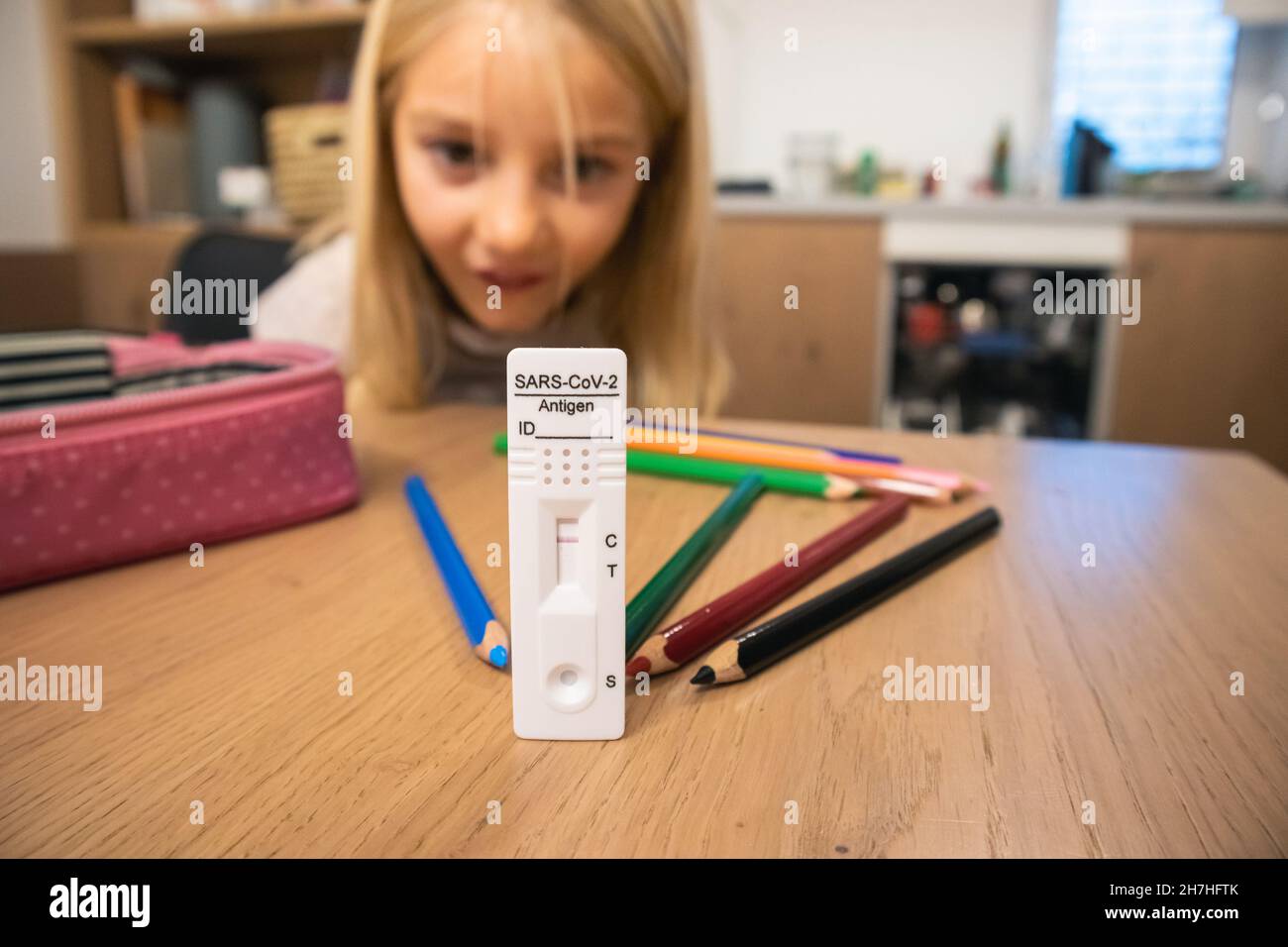 Girl child self testing at home for coronavirus before going to school ...