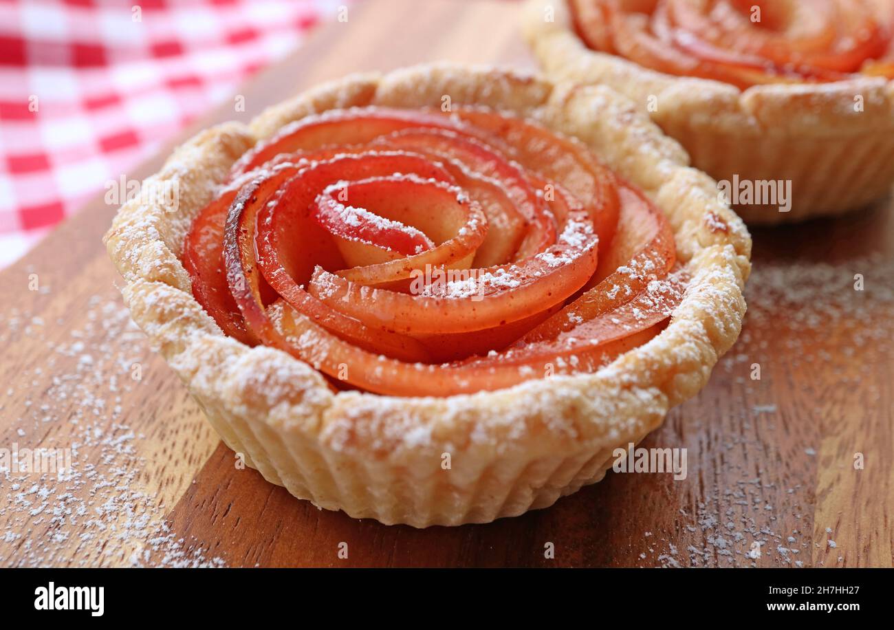 Closeup of a Mouthwatering Mini Apple Rose Shaped Tartlet on a Wooden ...