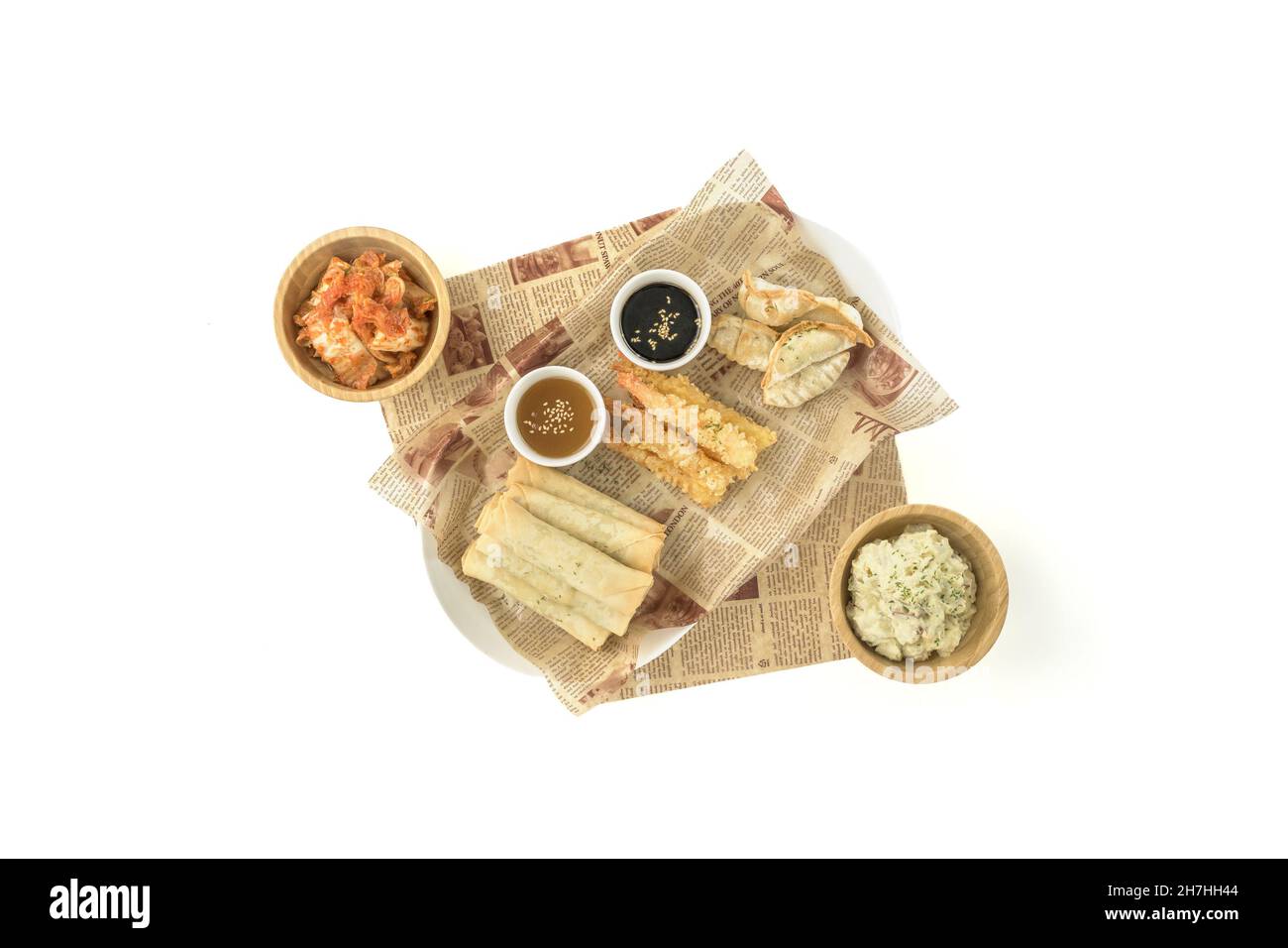 Closeup shot of fried spring rolls, tempura, and dim sum isolated on a ...