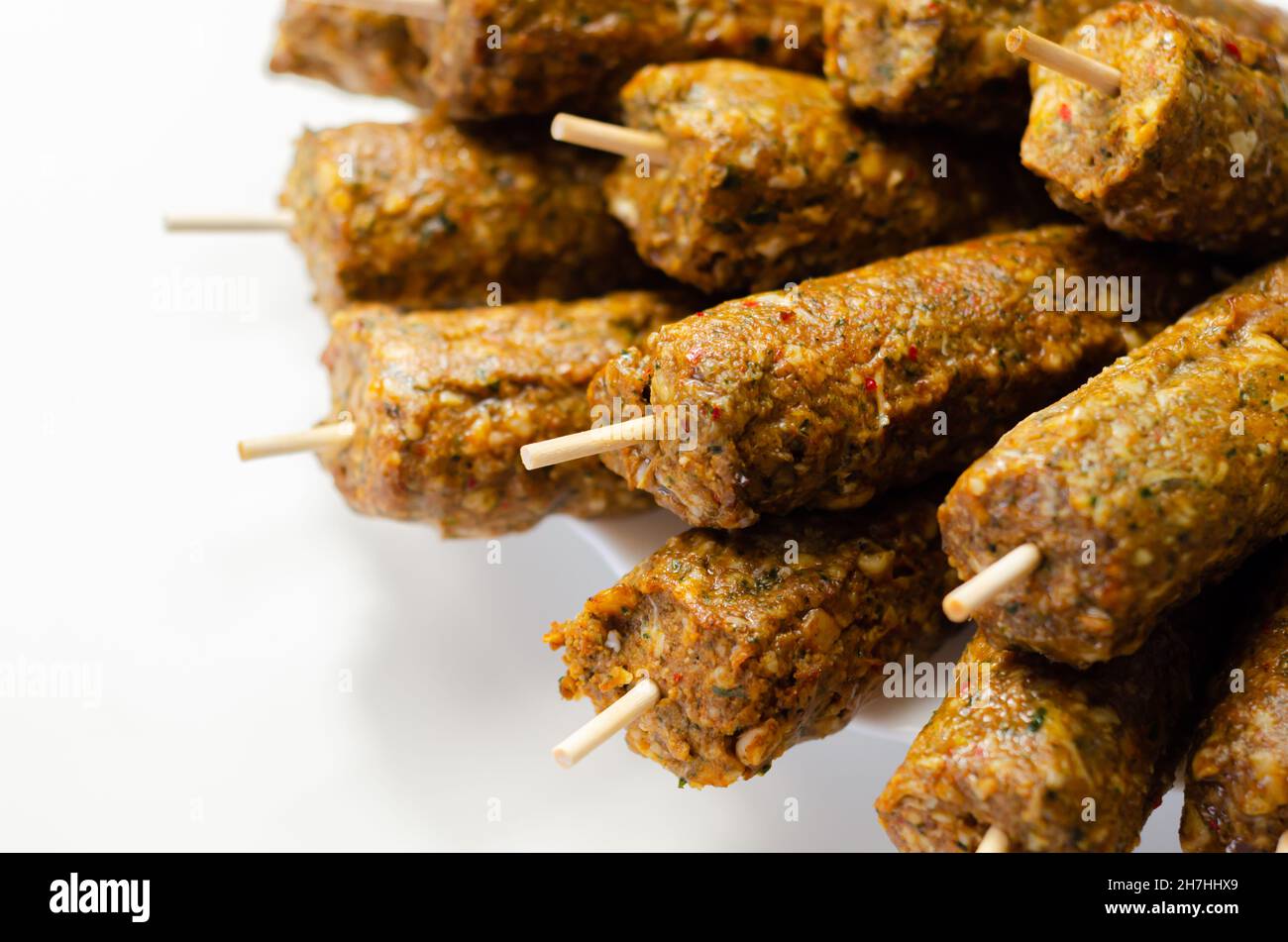 Minced and shaped lamb kebabs with chilli and coriander prepared for ...