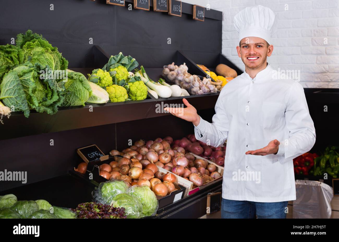 Male cook choosing vegetables in grocery shop Stock Photo - Alamy
