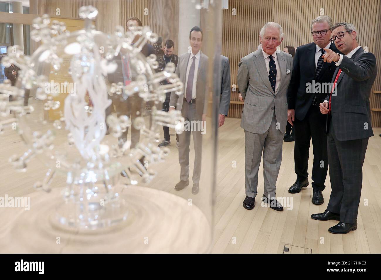 The Prince of Wales (left) is shown Luke Jerram's Covid vaccine ...