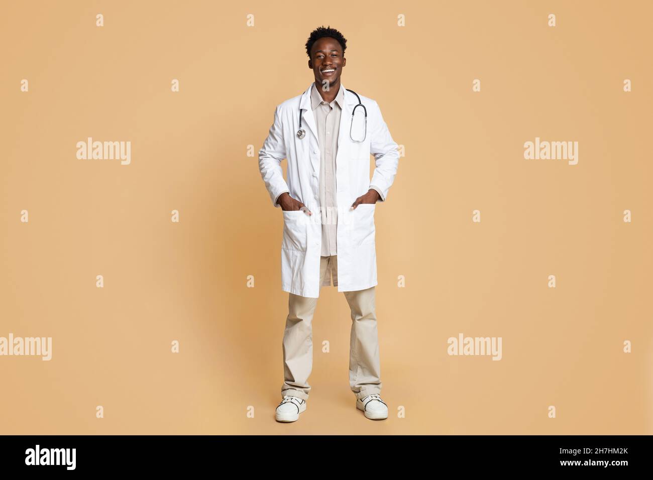 Portrait Of Smiling Young African American Doctor Wearing Uniform And ...