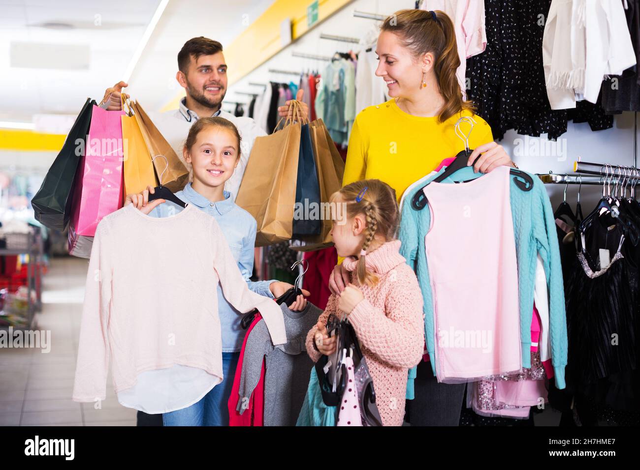 Family after shopping in store Stock Photo - Alamy