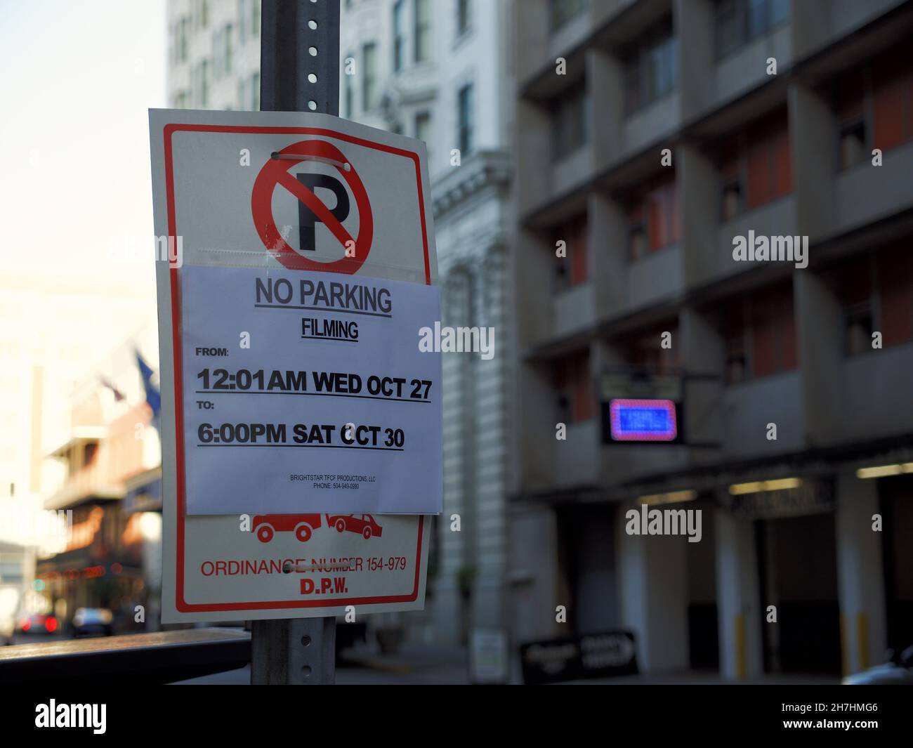 Parking hours information plate on a street pillar Stock Photo - Alamy