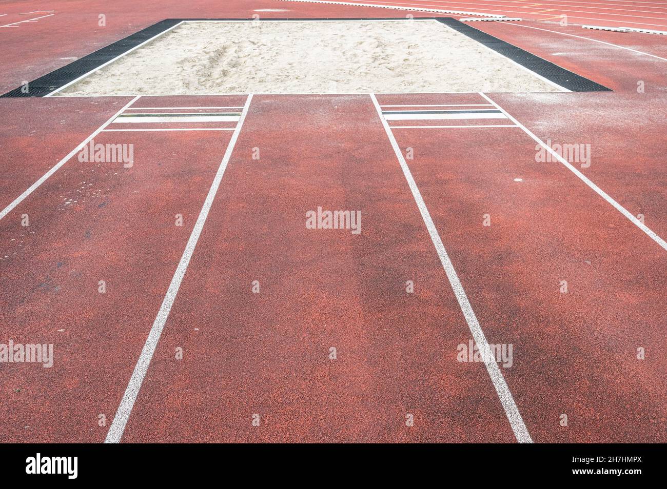 Jump pit filled with sand, and leading lines Stock Photo - Alamy