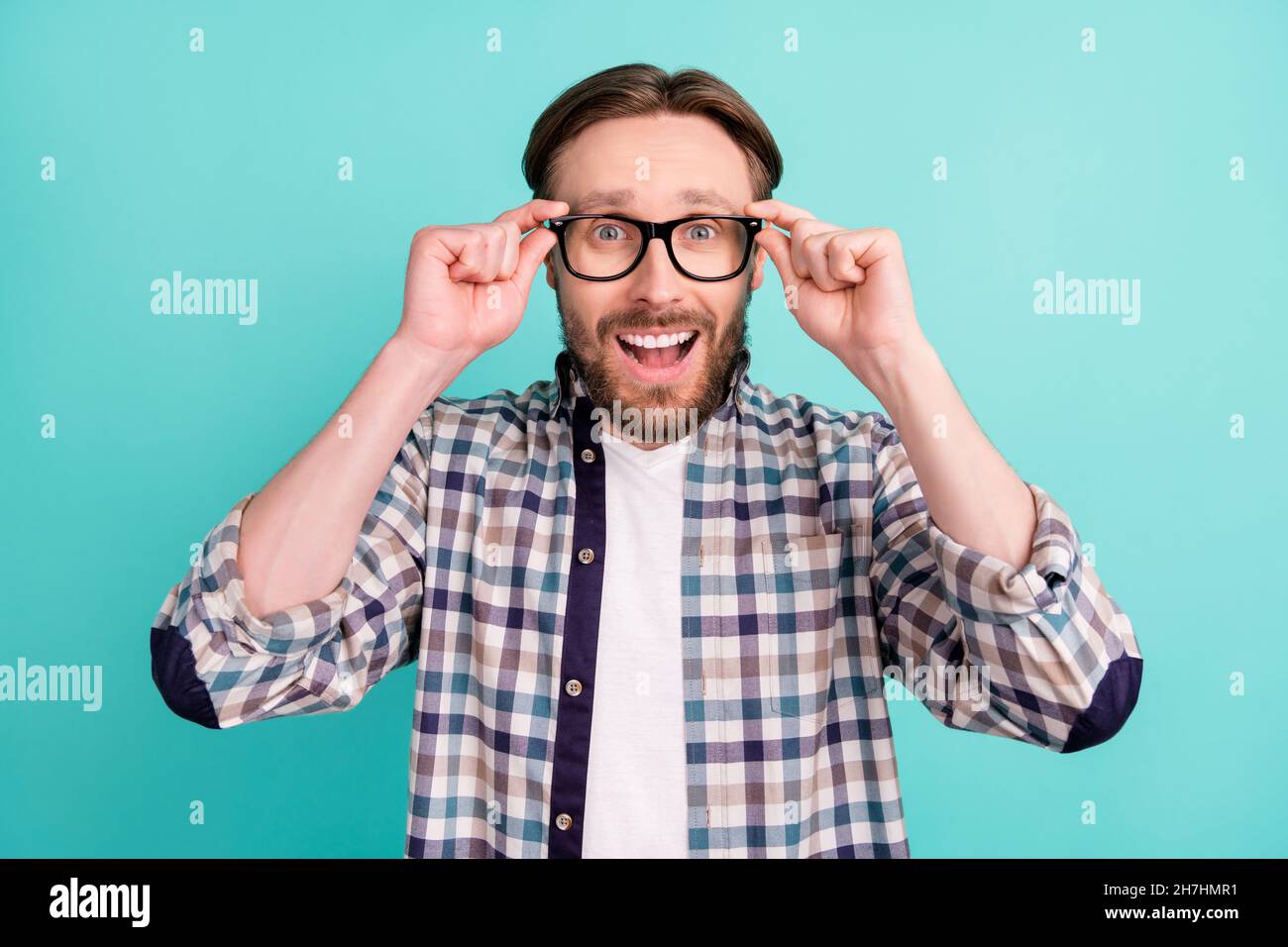 Photo of young man happy positive smile amazed surprised put eyeglasses ...