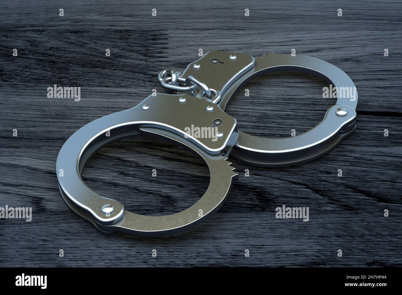 Police metal handcuffs on dark wooden background Stock Photo - Alamy