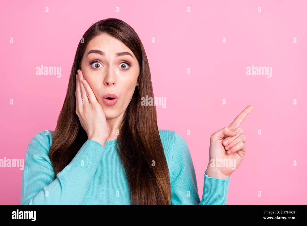 Photo Of Impressed Funny Young Woman Wear Blue Sweater Arm Cheek