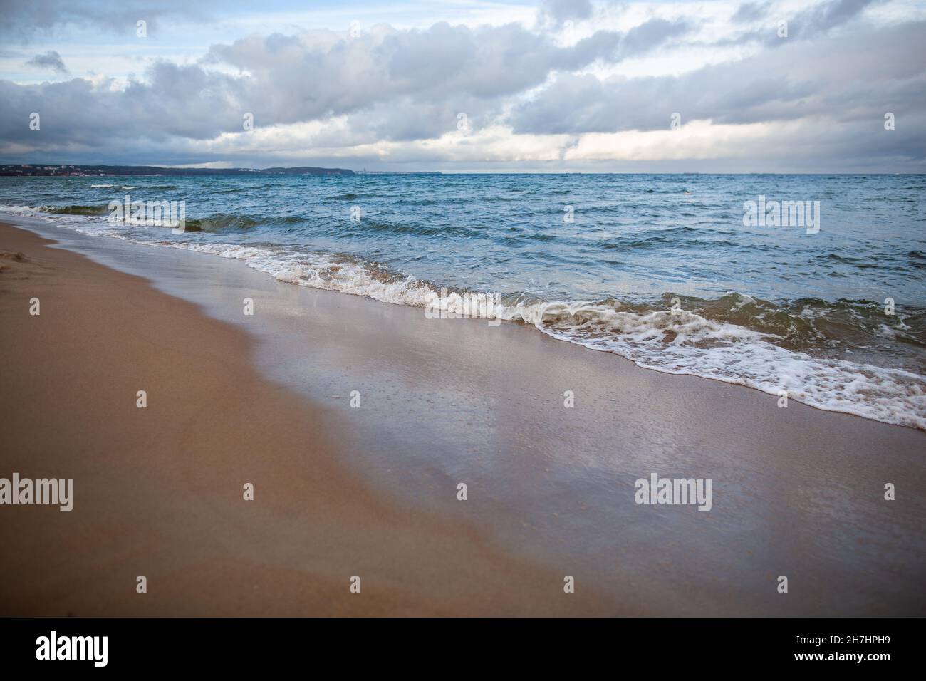 Sea waves crashing on a beach Sky reflection on wet sand Beautiful ...