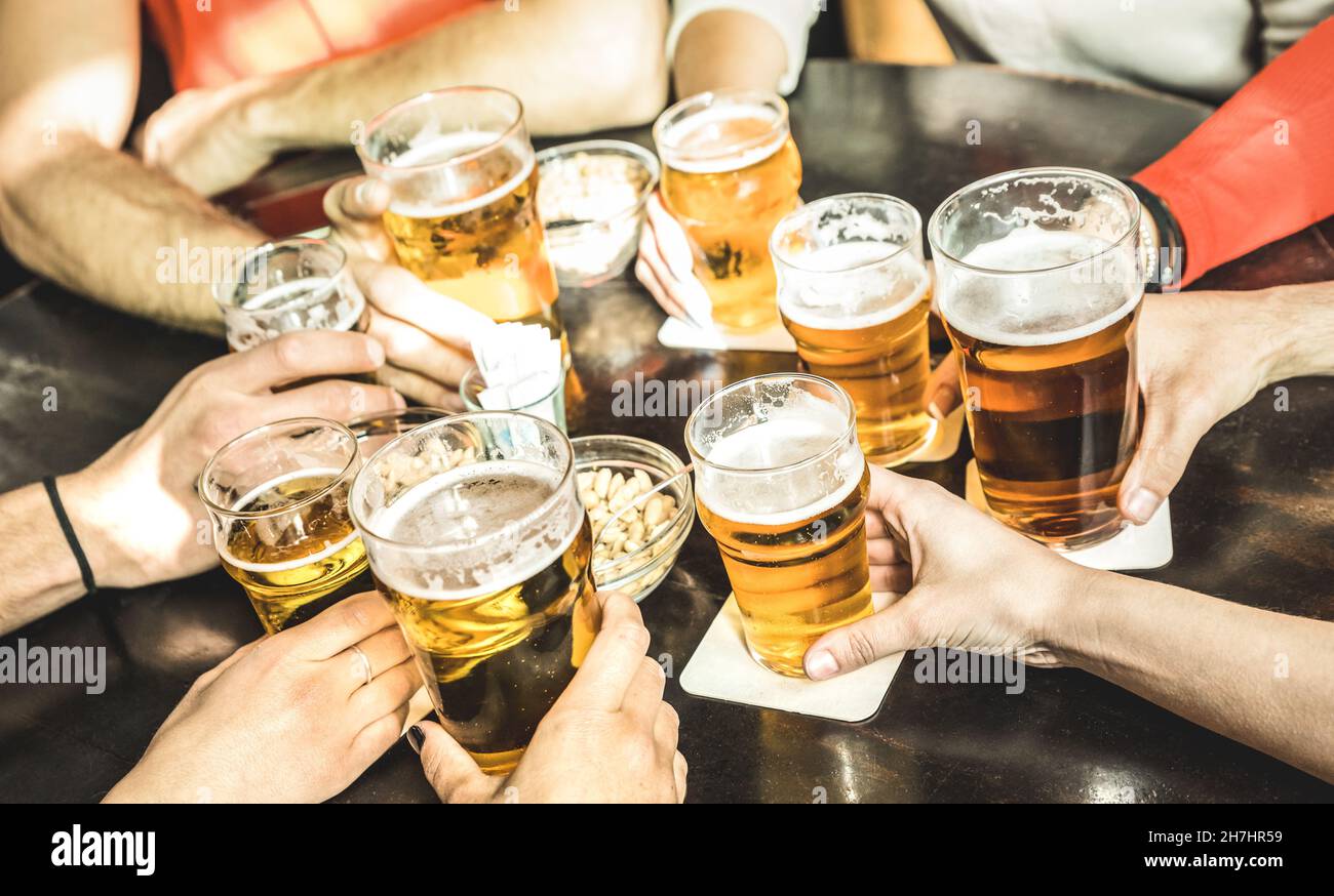 Friends hands drinking beer at brewery pub restaurant - Friendship ...