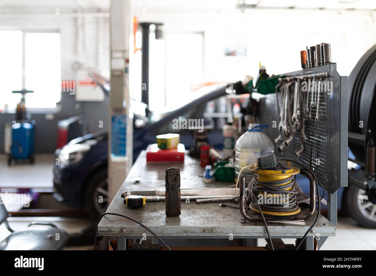 Photo of a metal table with working tools for working and repairing an ...