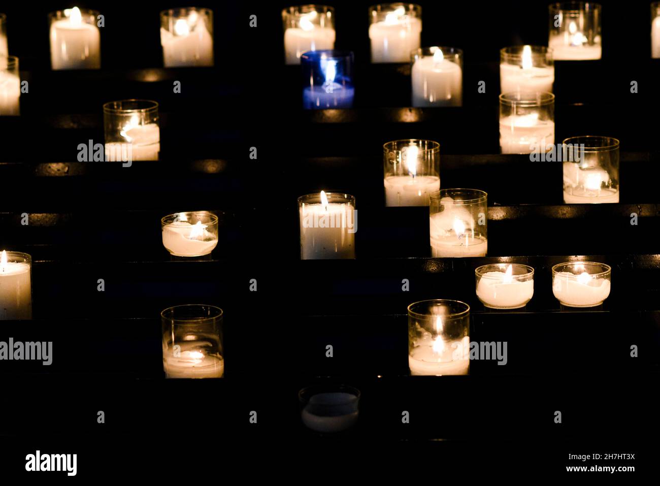 Candles lit in the church for prayers Stock Photo - Alamy