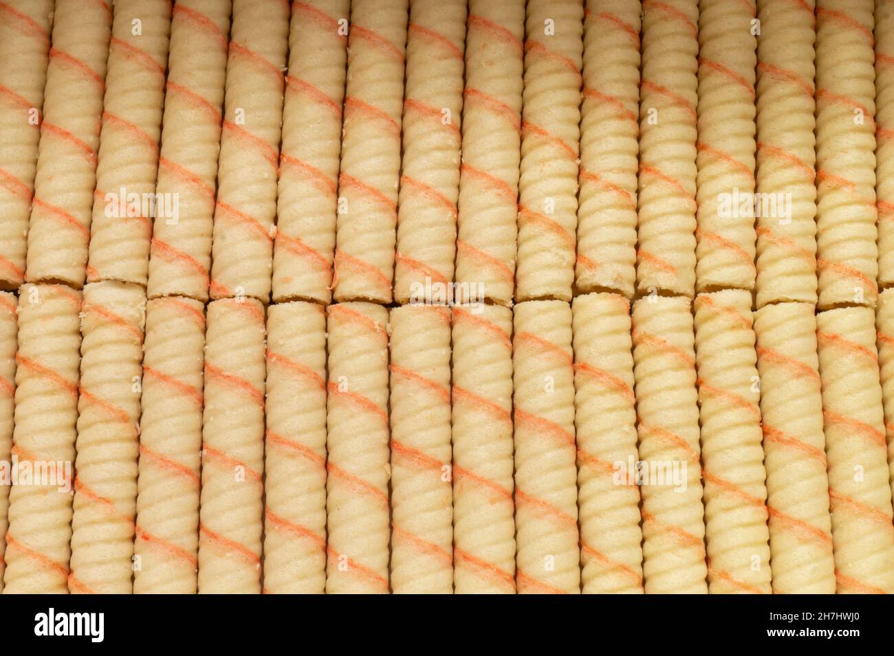 Sweet sticks with stuffing wrapped in a roll . Top view of dessert ...