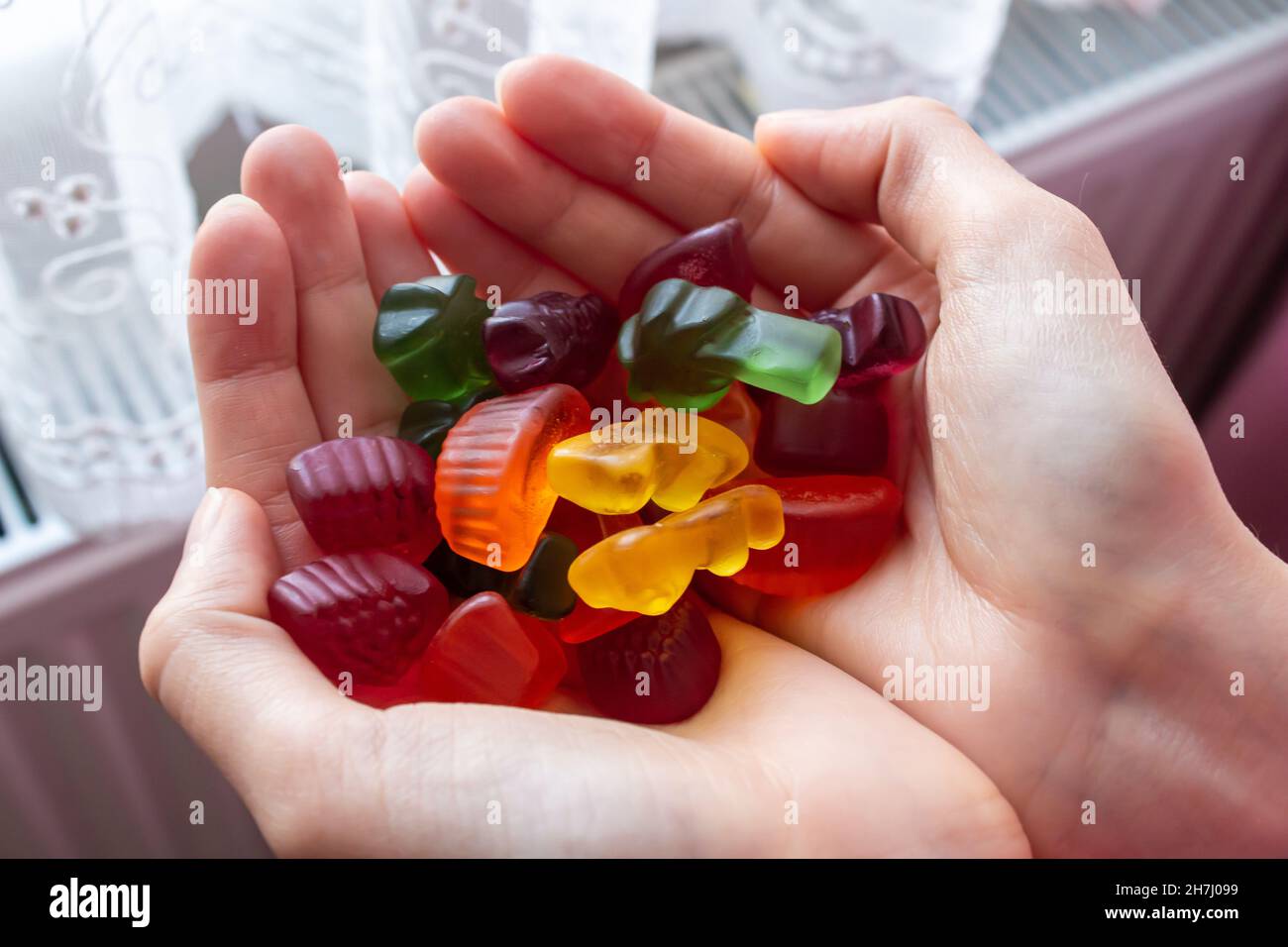 Woman holding candy, close up photo of jelly candy in girl hand Stock ...