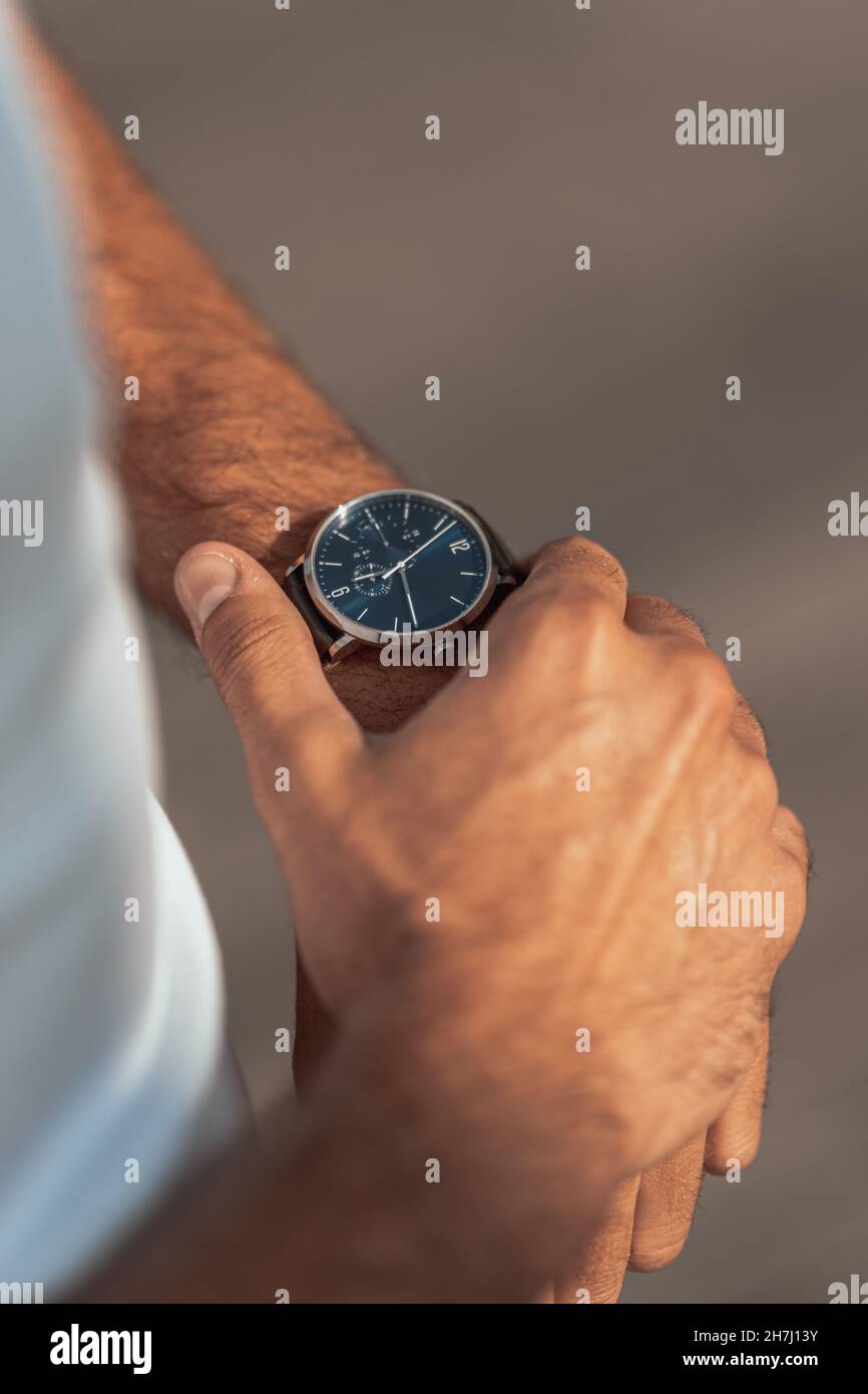 Businessman looking watch checking hi-res stock photography and images ...