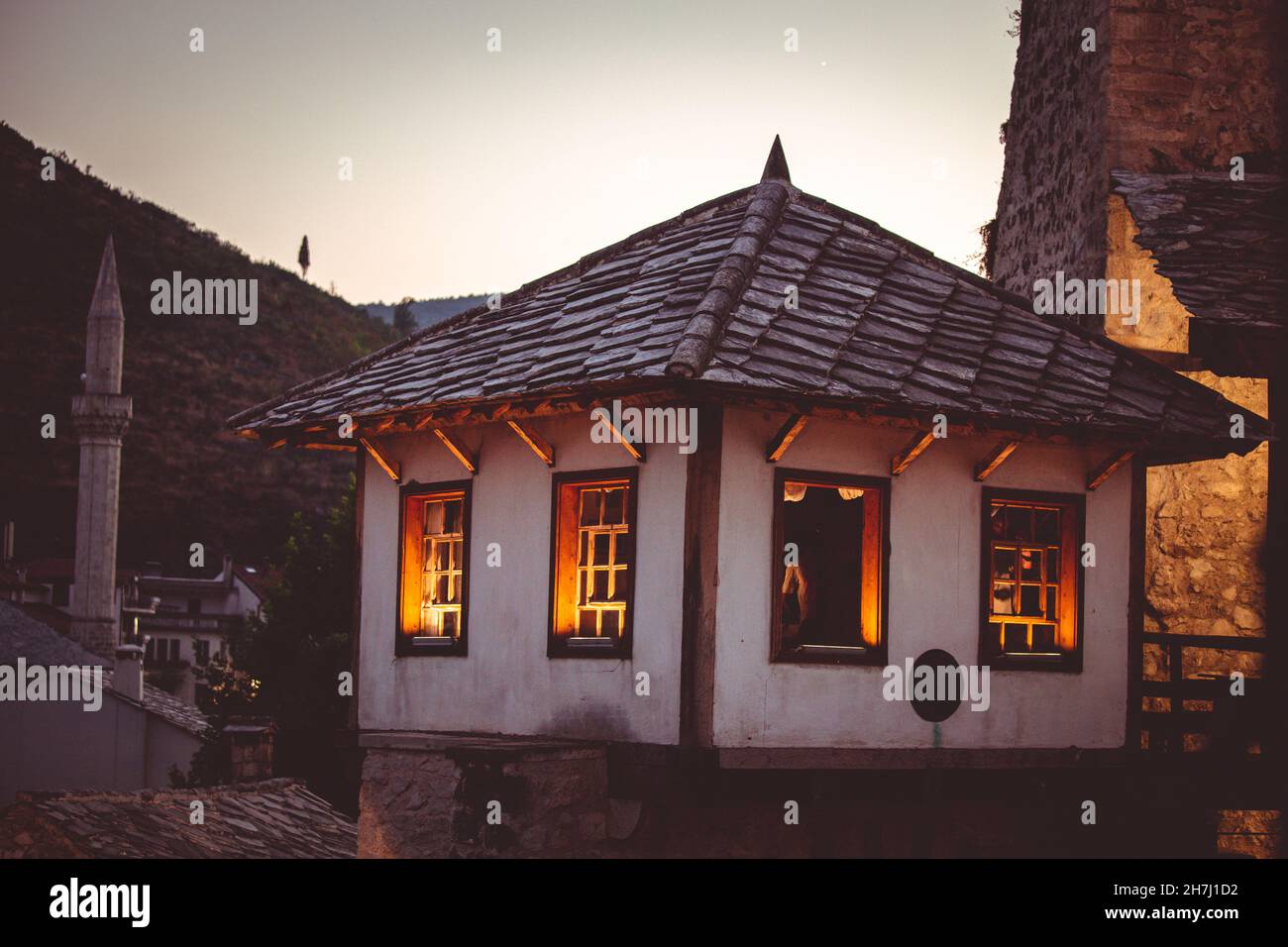 View of a small beautiful house with four windows and lights Stock ...