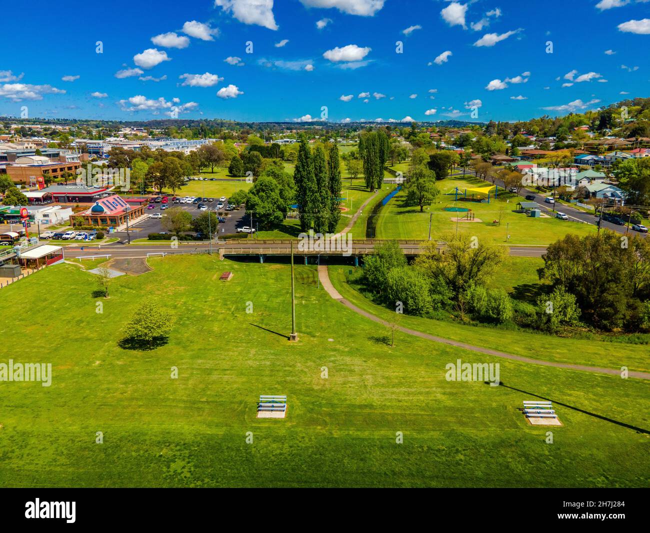 Aerial view of the town of Armidale with colorful buildings and green ...