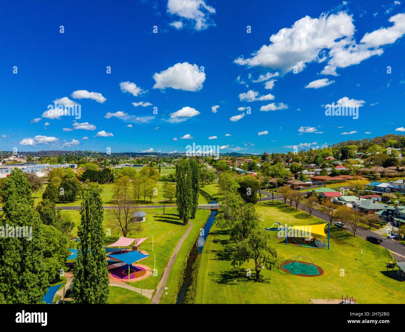 Aerial view of the town of Armidale with colorful buildings and green ...