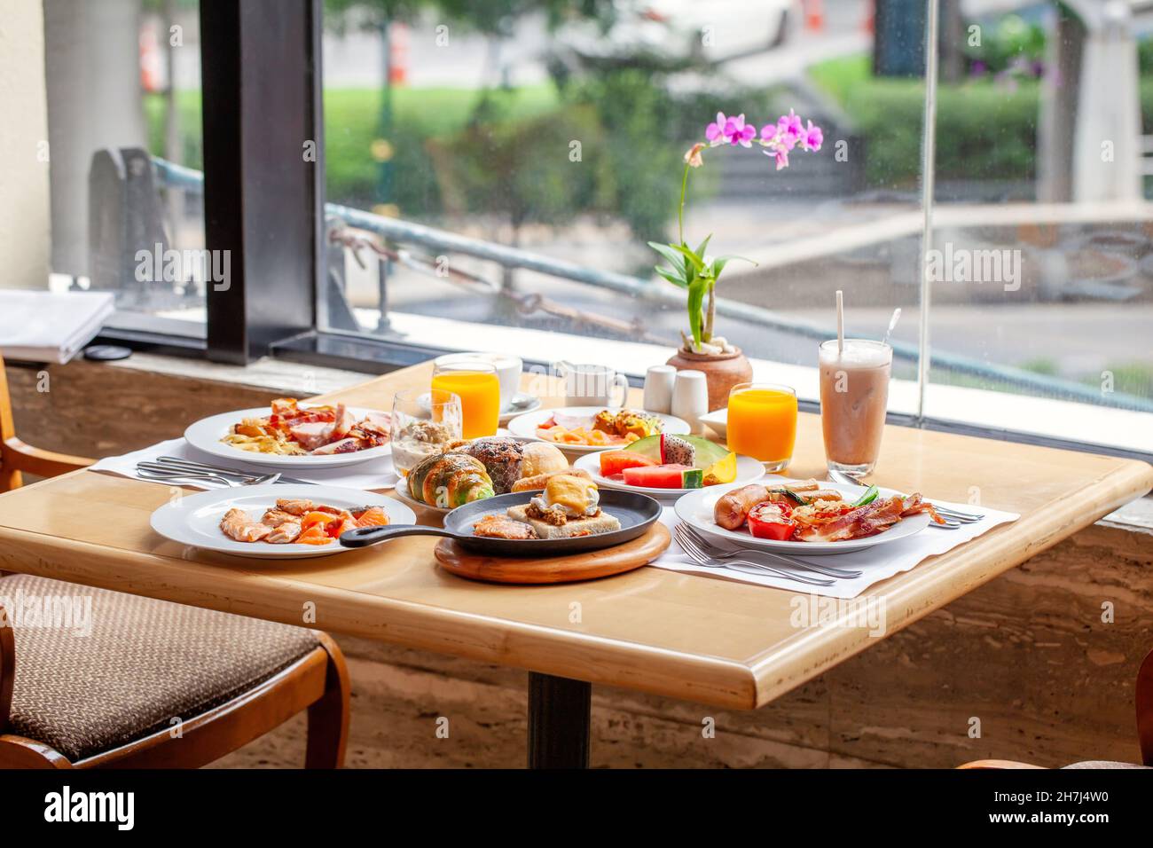 Breakfast in luxury hotel. Table full various food from buffet in ...