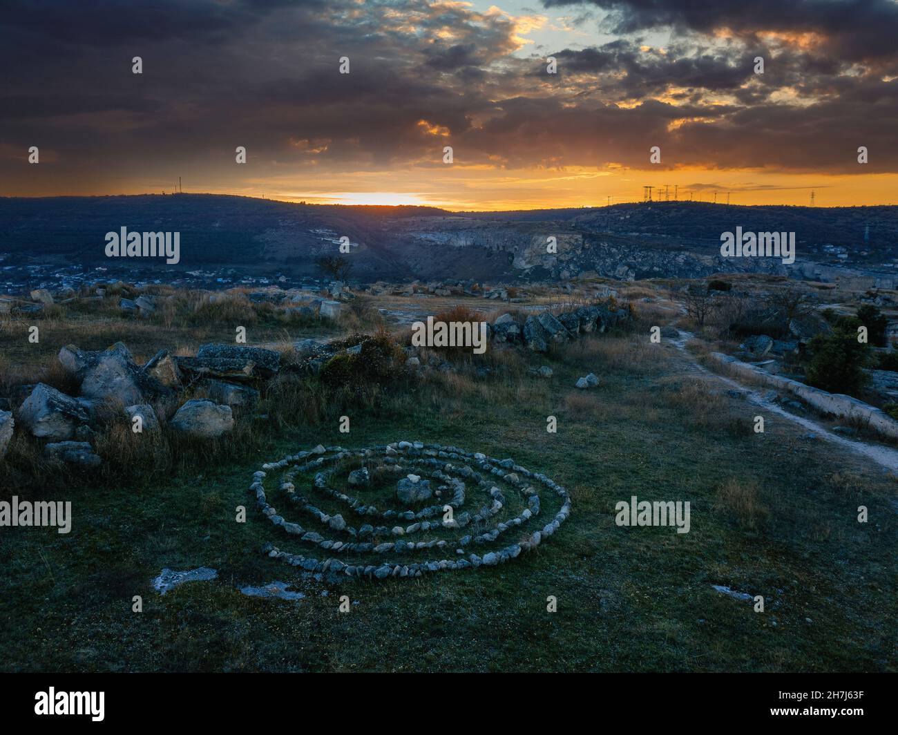 Spiral labyrinth made of stones at the sunset Stock Photo - Alamy